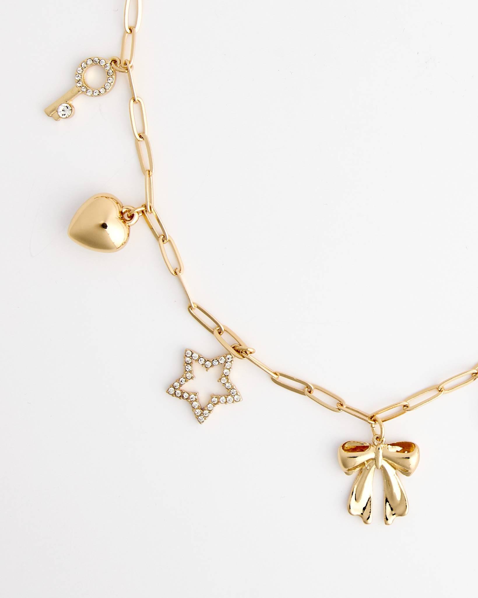 Bow Multi Charm Chain Necklace in Gold | Uncharted Threads | The Paper ...